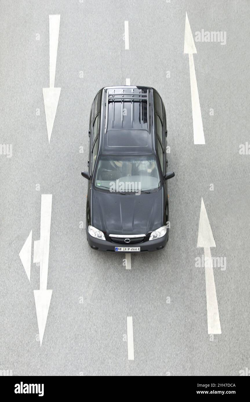 Car from above between lane direction arrows, Federal Republic of ...