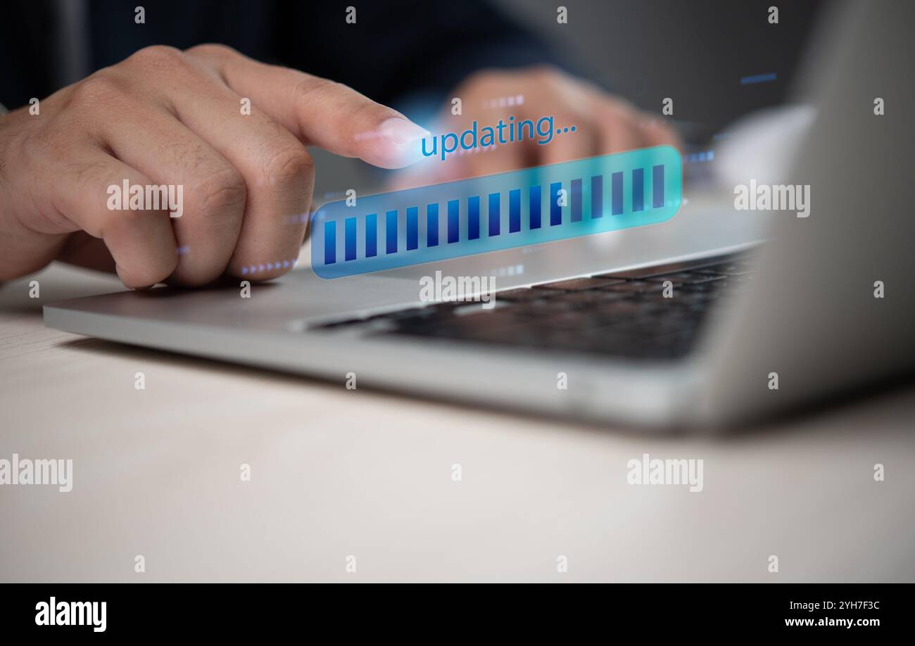 Laptop is showing an update screen with a progress bar hi-res stock photography and images - Alamy