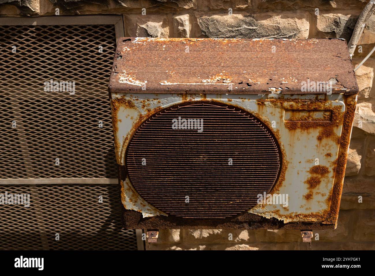 Rusty Air Conditioning Unit on Stone Wall Stock Photo - Alamy