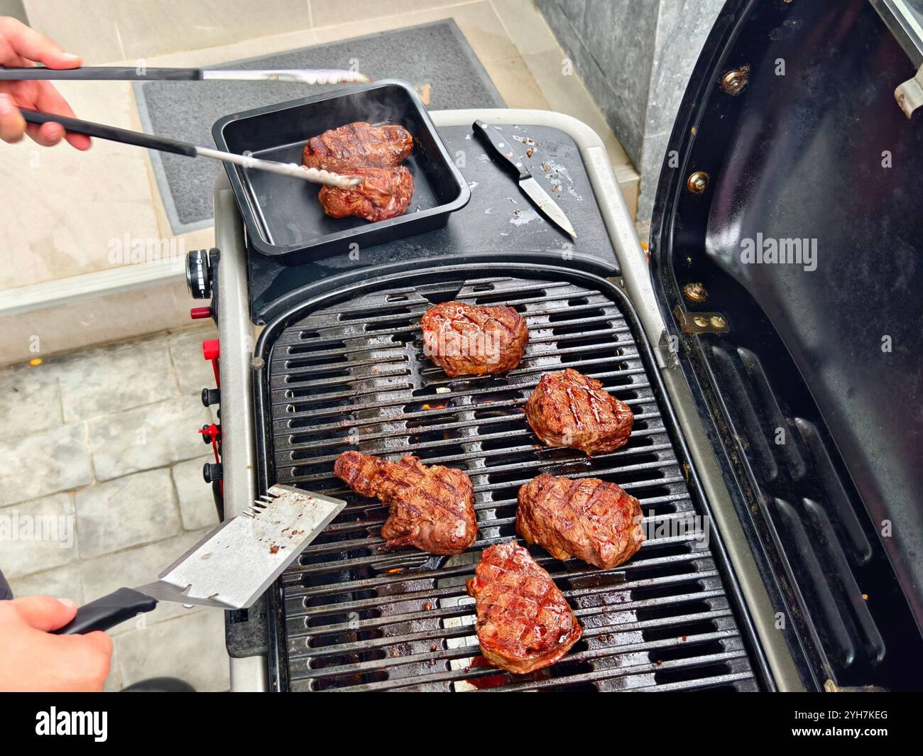 Sizzling grilled meat that showcases a perfect char Stock Photo - Alamy