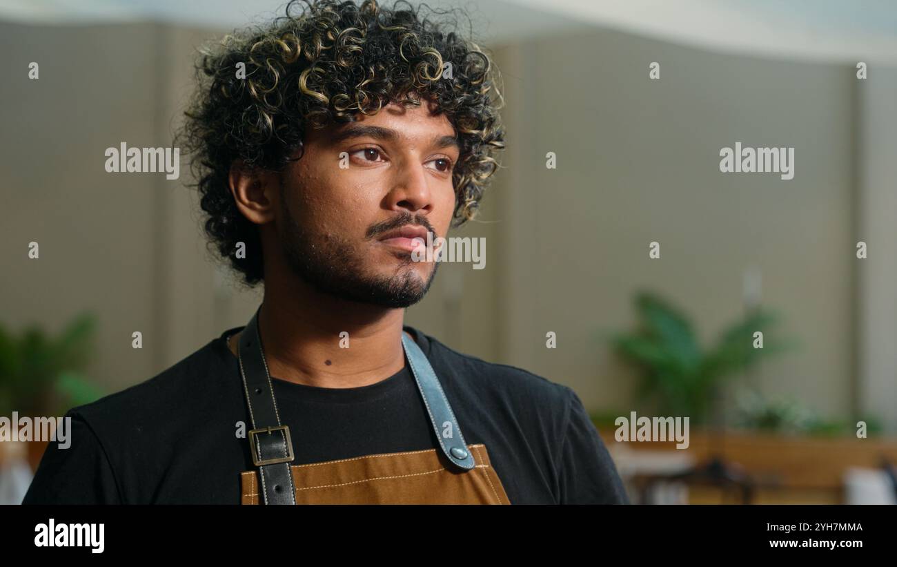 Happy smiling joyful young Indian Arabian man cafe worker in apron male ...