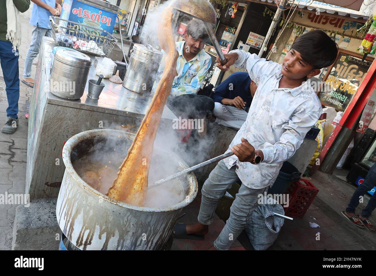 Chai vendor in making tea in Babra, Gujarat, India Stock Photo - Alamy