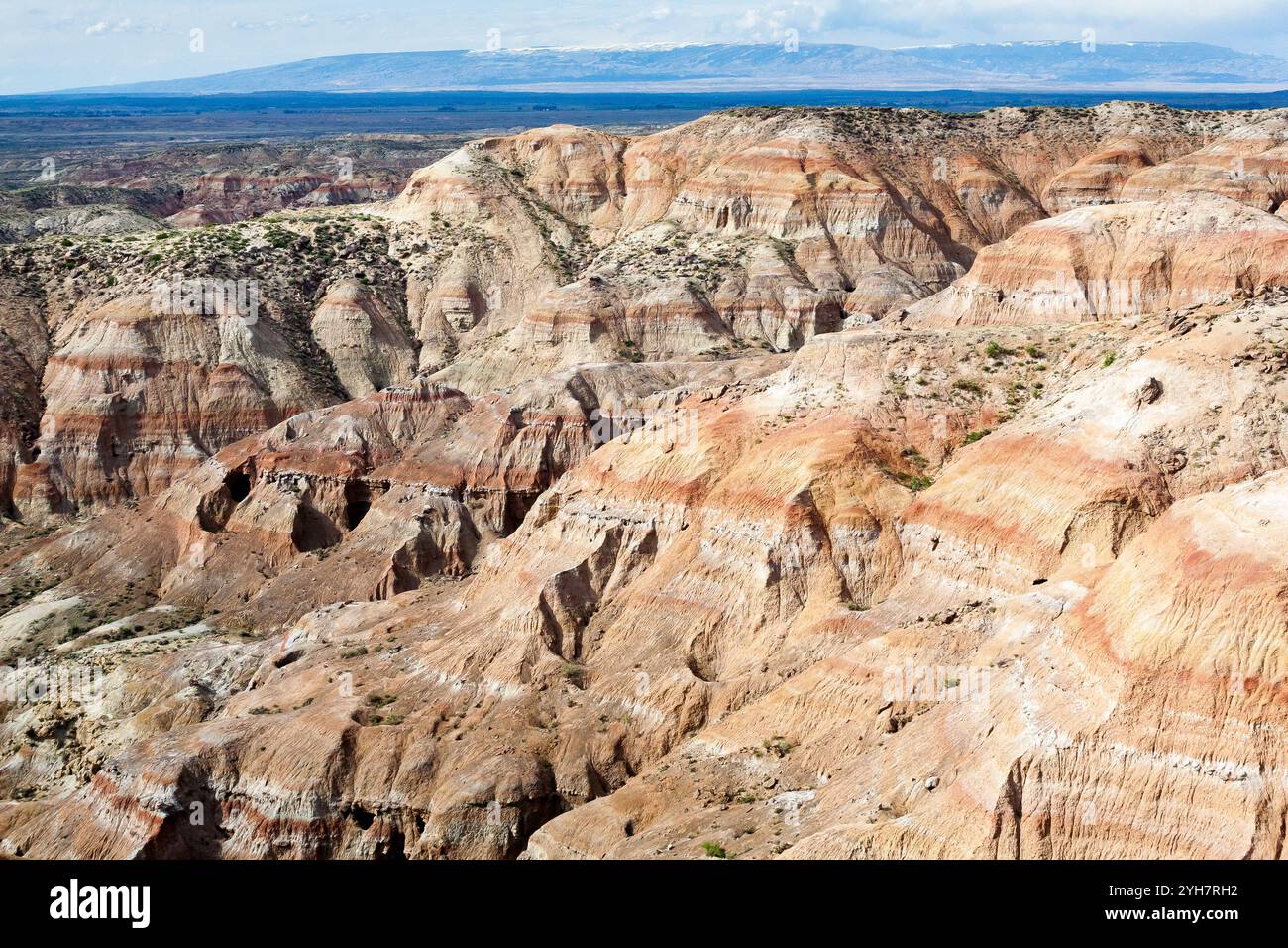 The Bighorn Mountains rise behind the badlands of the Bighorn Basin in ...