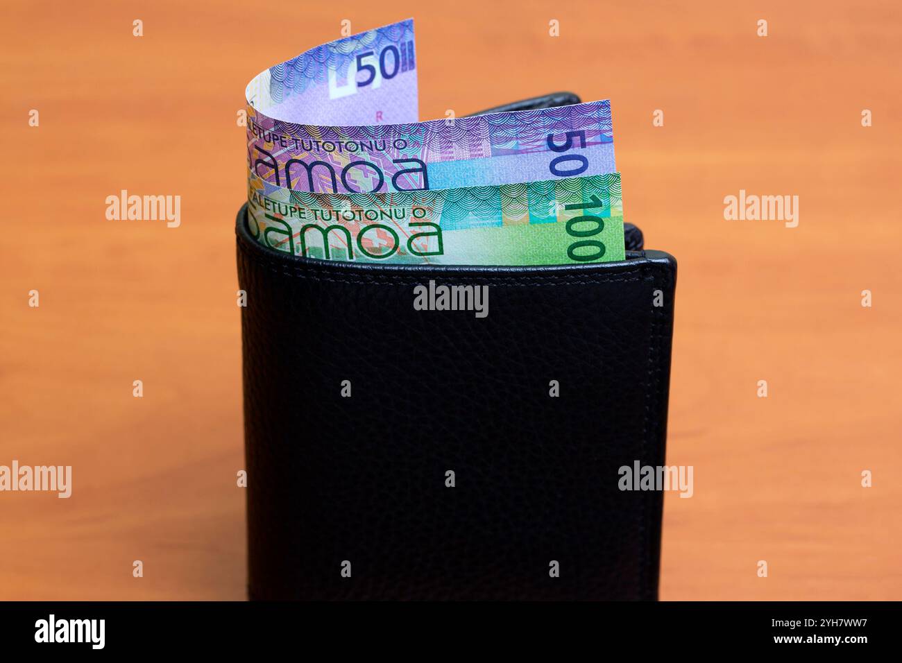 Samoan money - tala in the black wallet Stock Photo - Alamy