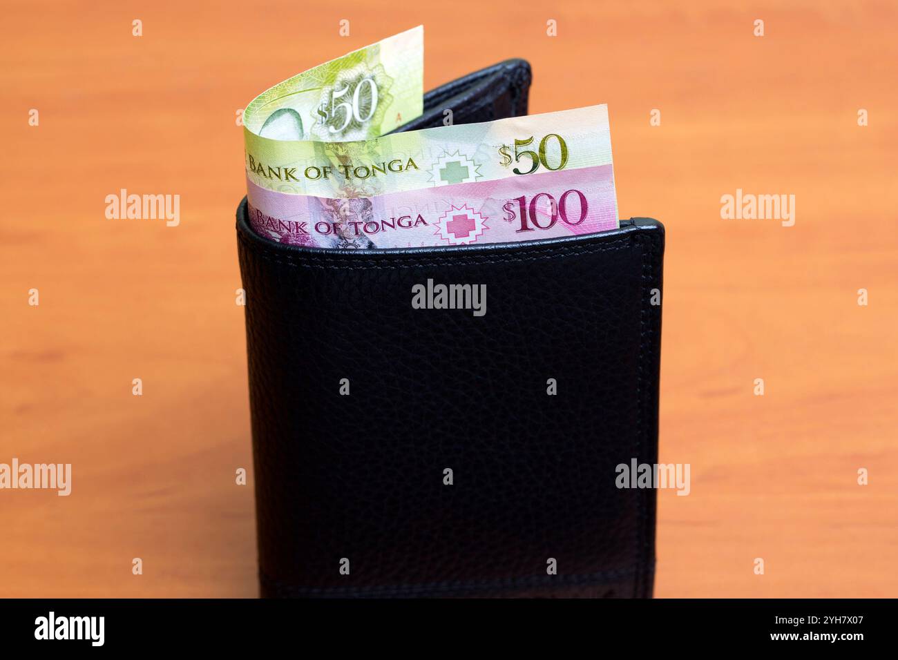 Tongan money - paanga - in the black wallet Stock Photo - Alamy