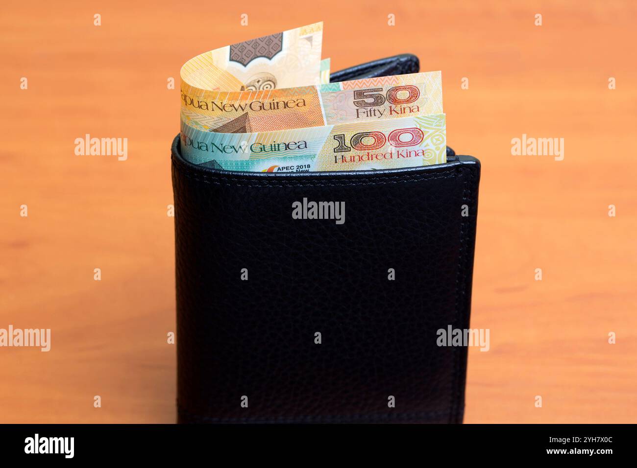 Papua New Guinean money - kina in the black wallet Stock Photo - Alamy