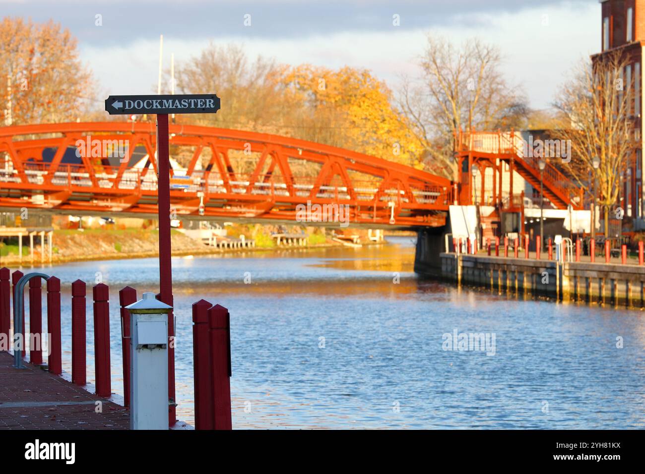Dockmaster Sign Along Waterway With Bridge And Fall Colors In The ...