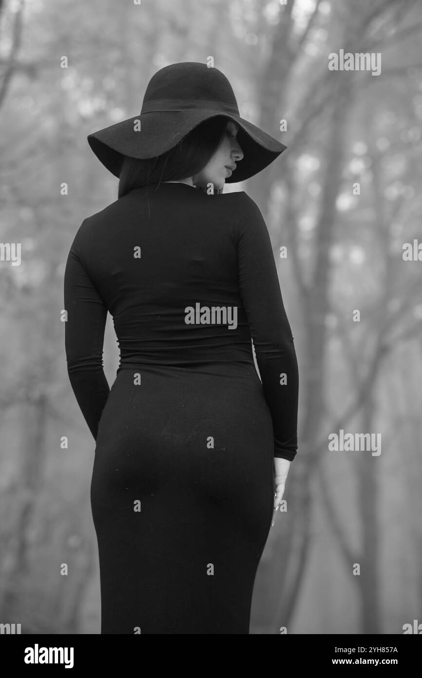 Mysterious figure wearing black hi-res stock photography and images - Alamy