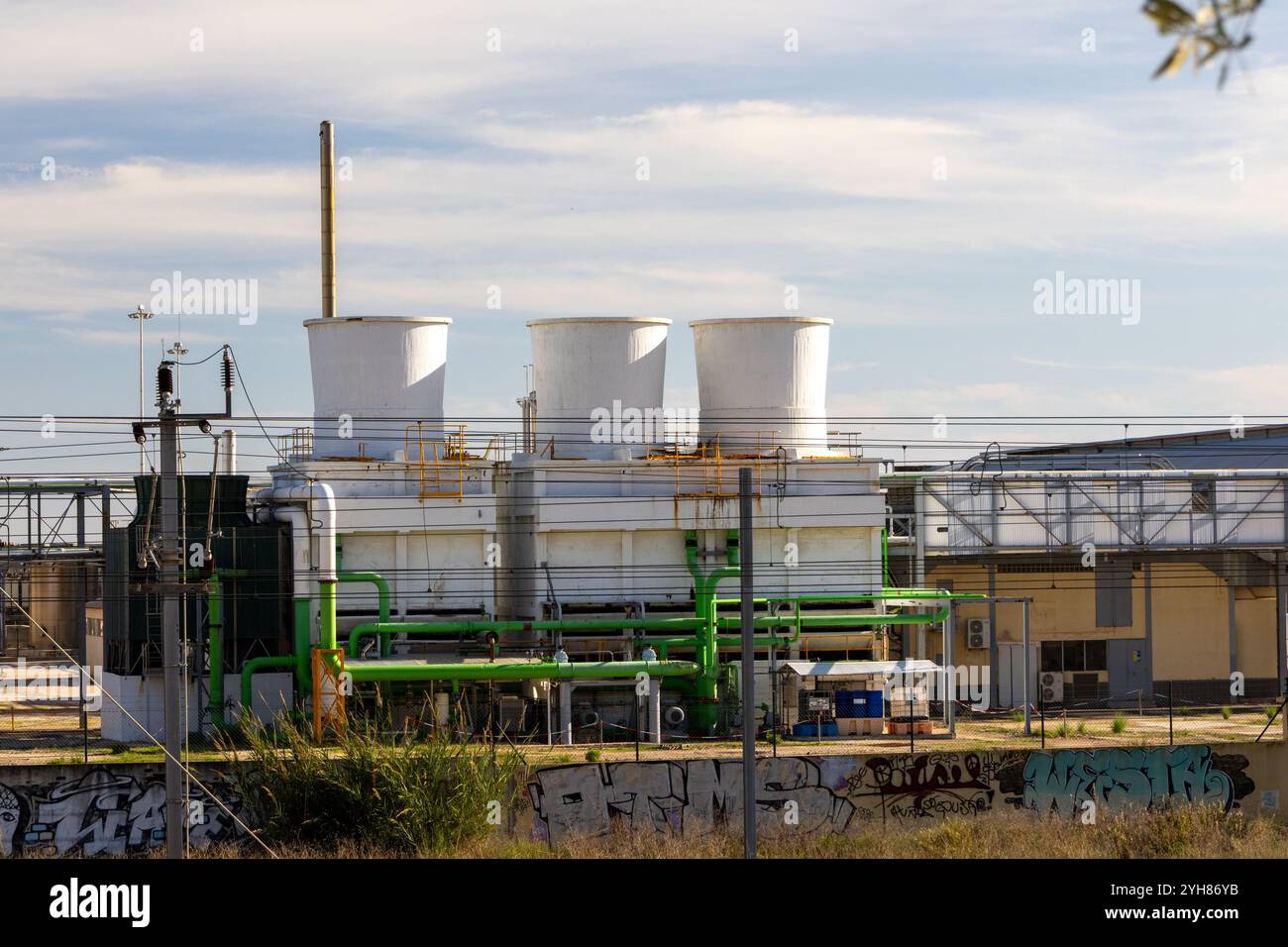 Cooling towers releasing excess heat in a power generation plant ...