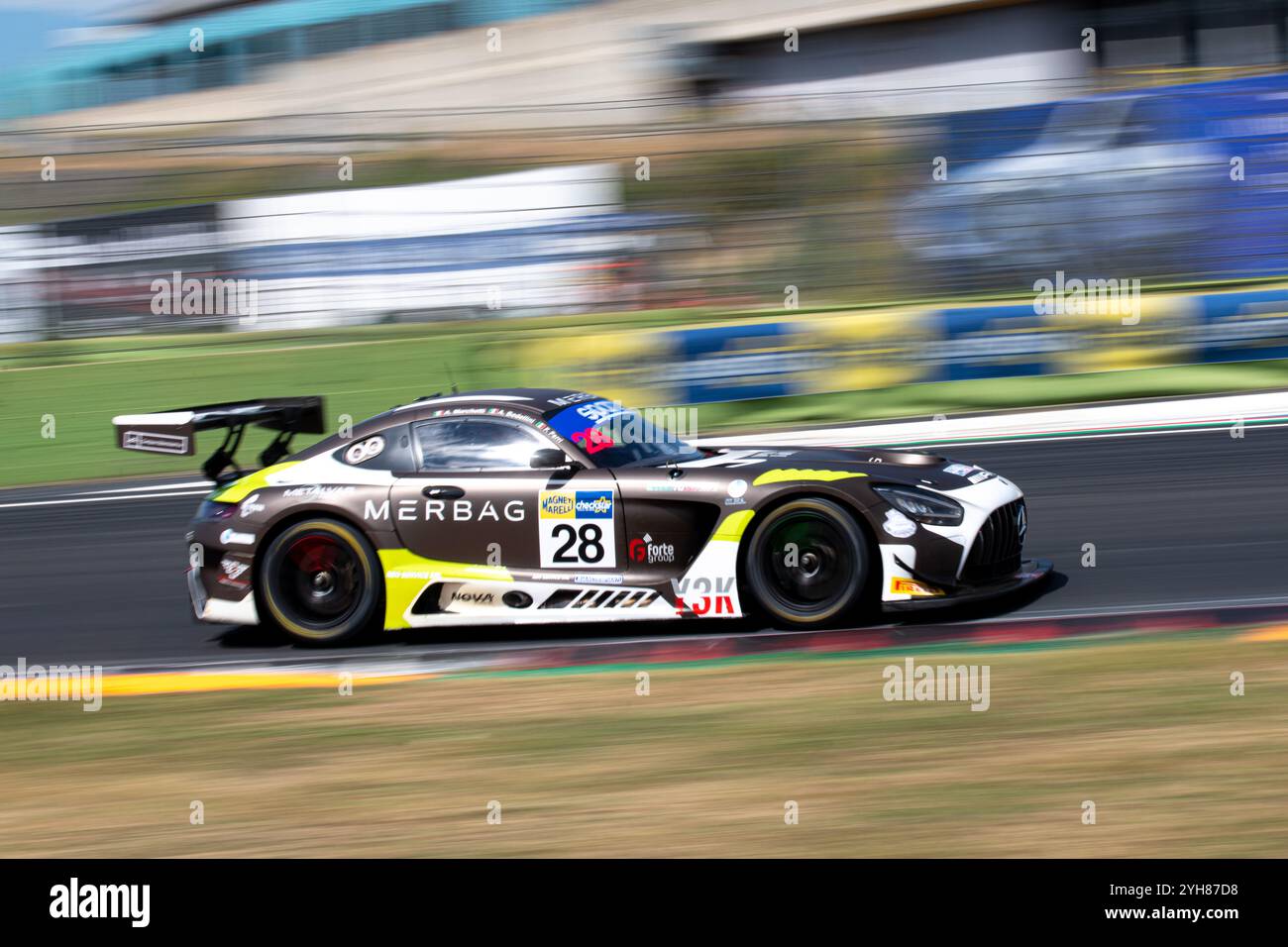 Modern mercedes amg gt3 racing car speeding on a racetrack during a ...