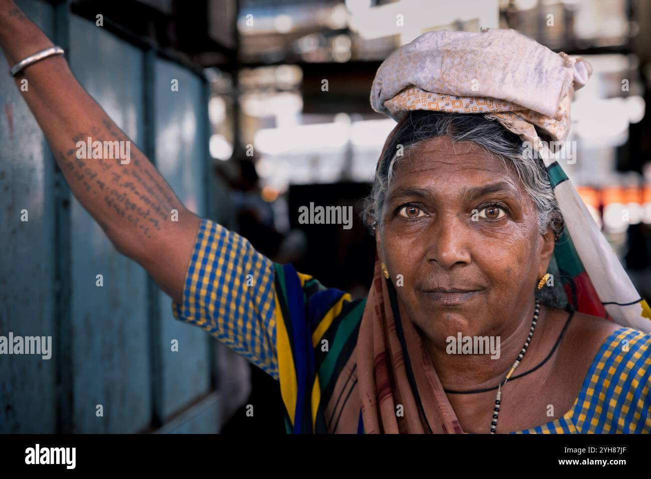 Portrait of a elderly female street vendor, Ahmedabad, Gujarat, India ...