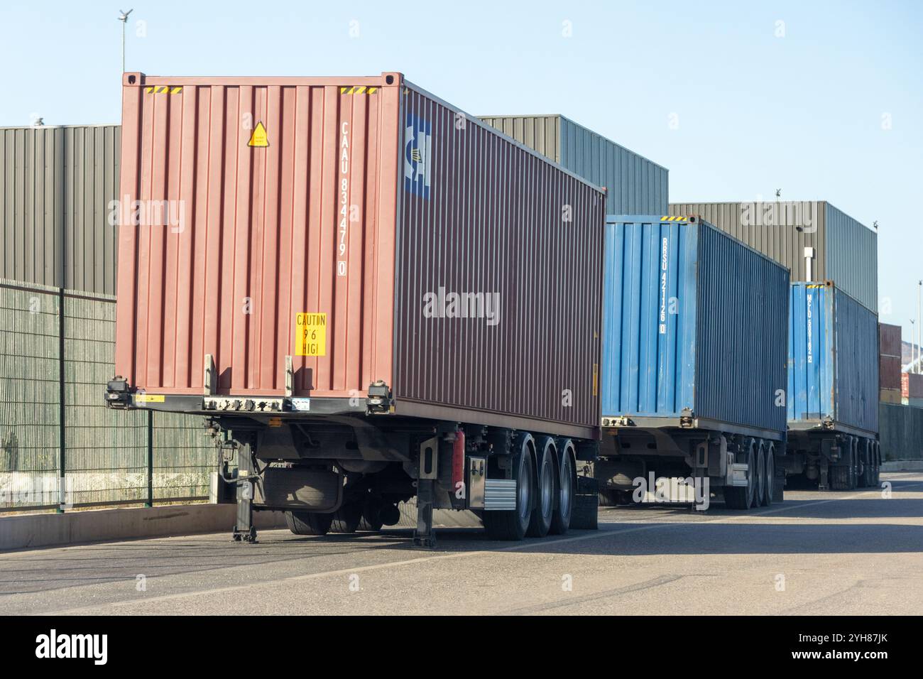 Intermodal freight transport with colorful cargo containers on semi ...