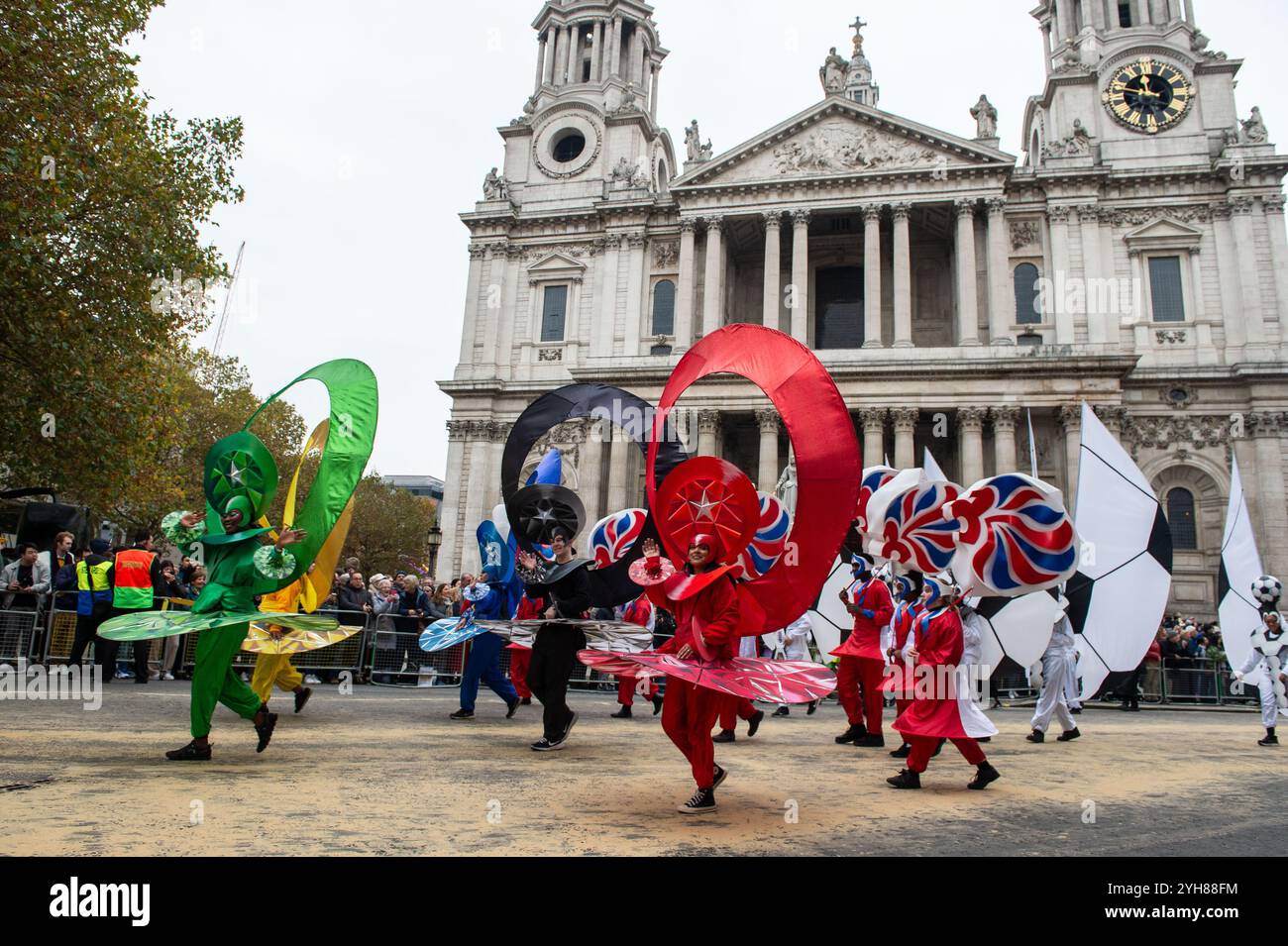 Participants in vibrant costumes and historic attire march in the ...