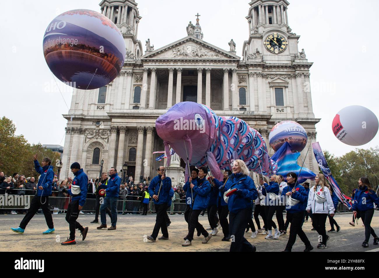 Participants in vibrant costumes and historic attire march in the ...