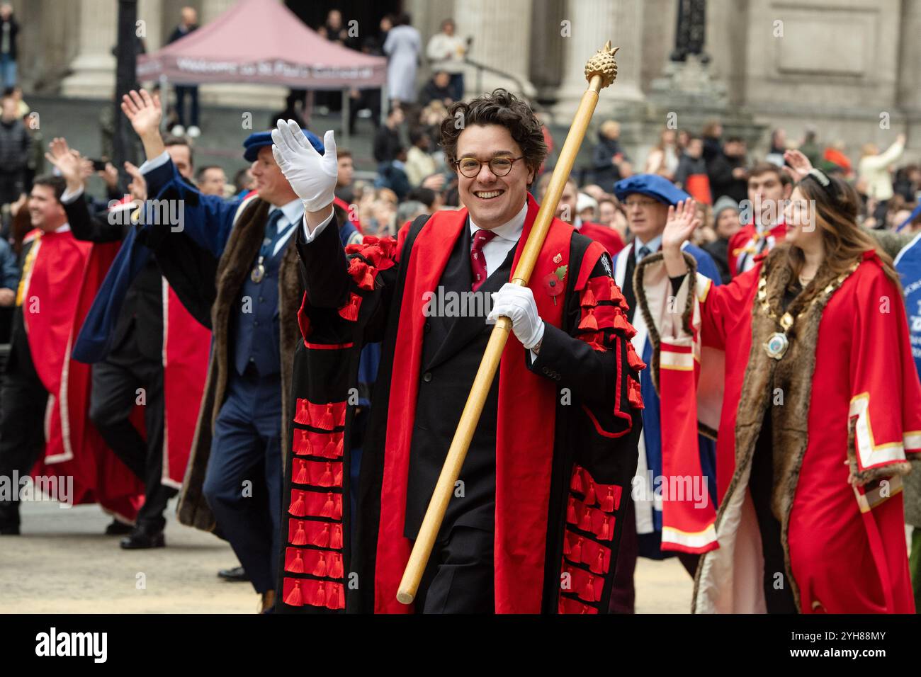 Participants in vibrant costumes and historic attire march in the ...