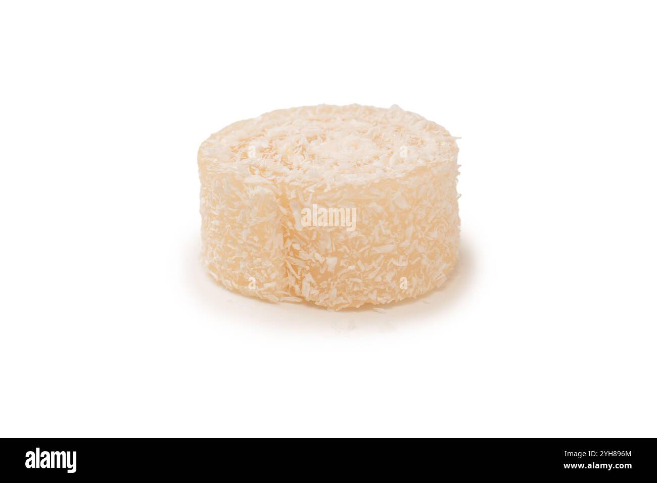 Coconut candy roll isolated on a white background Stock Photo - Alamy