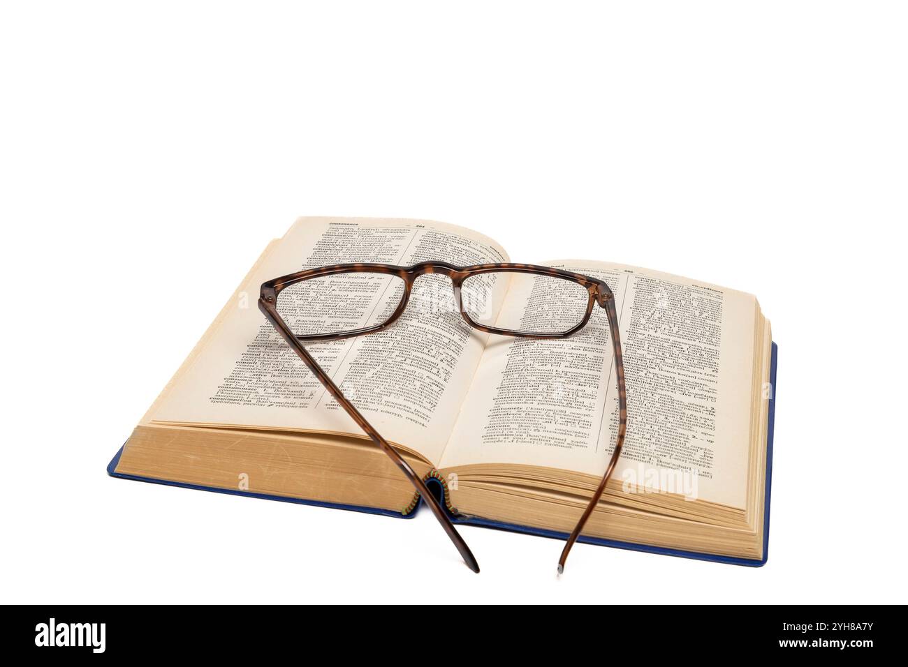 An old, open dictionary with glasses on white background Stock Photo ...