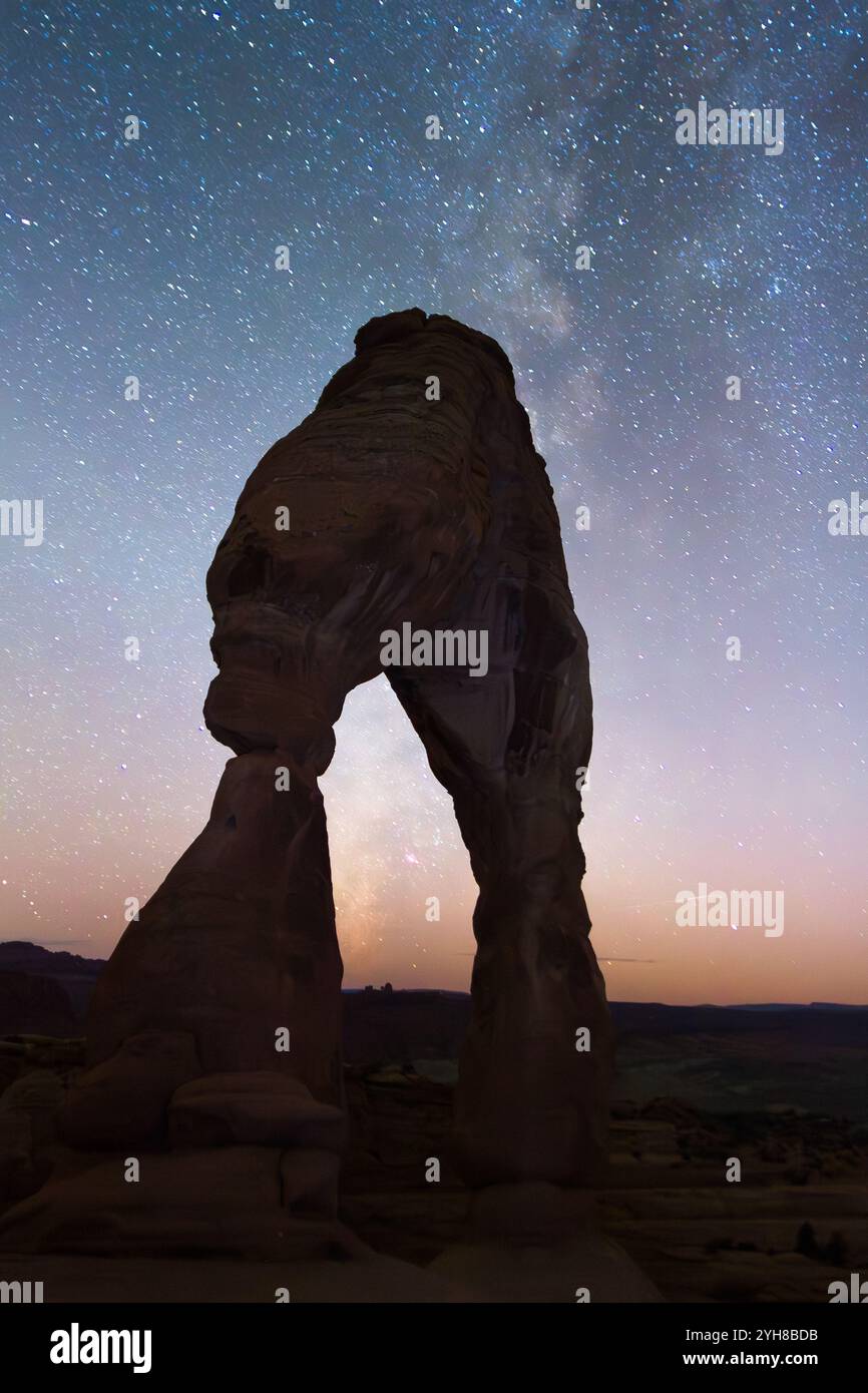 Delicate Arch stands below the Milky Way Galaxy in Arches National Park ...