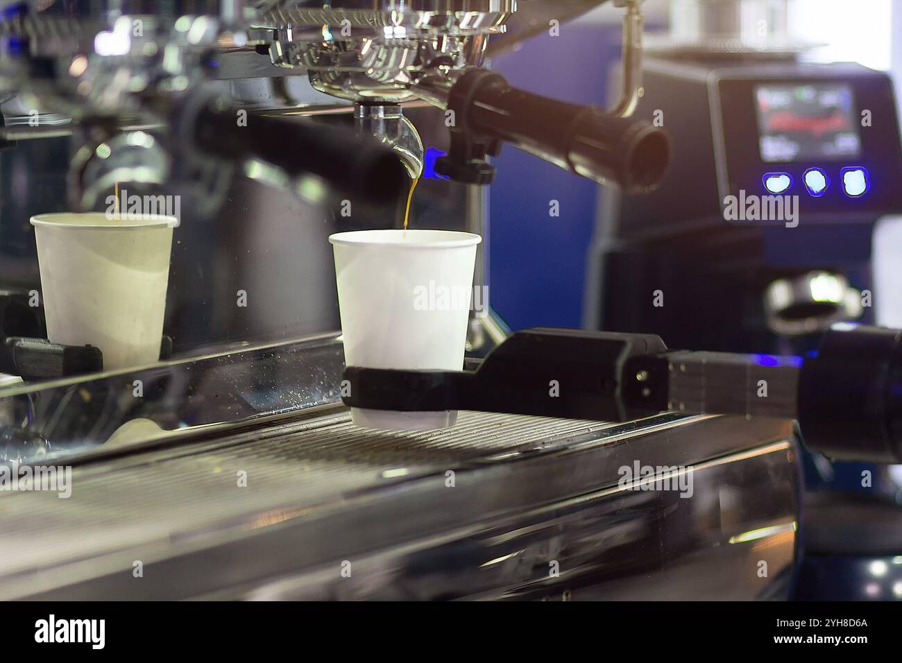 Robot with artificial intelligence making coffee on coffee machine ...