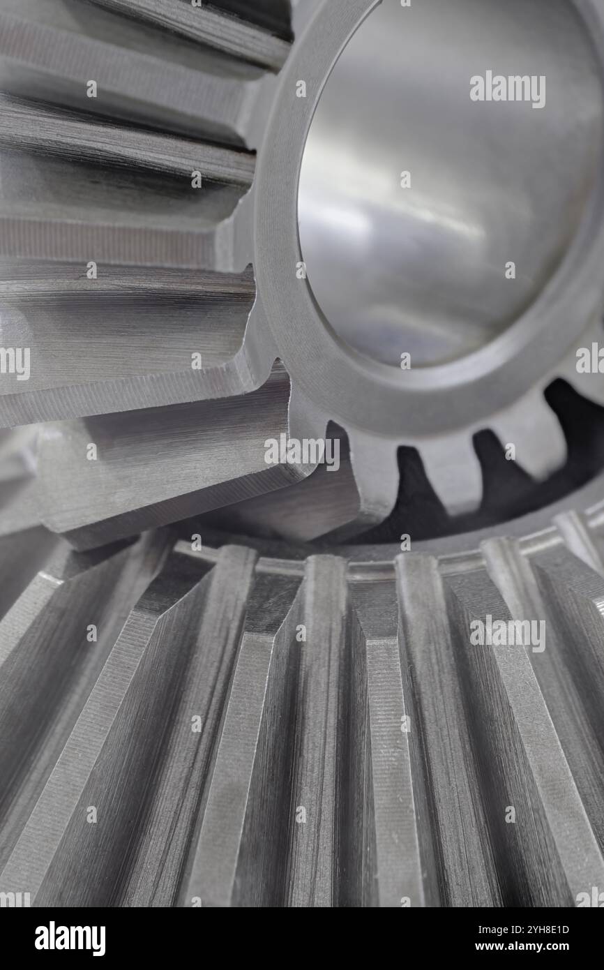 Two bevel gears, part of crossed gear transmission, close up shot ...