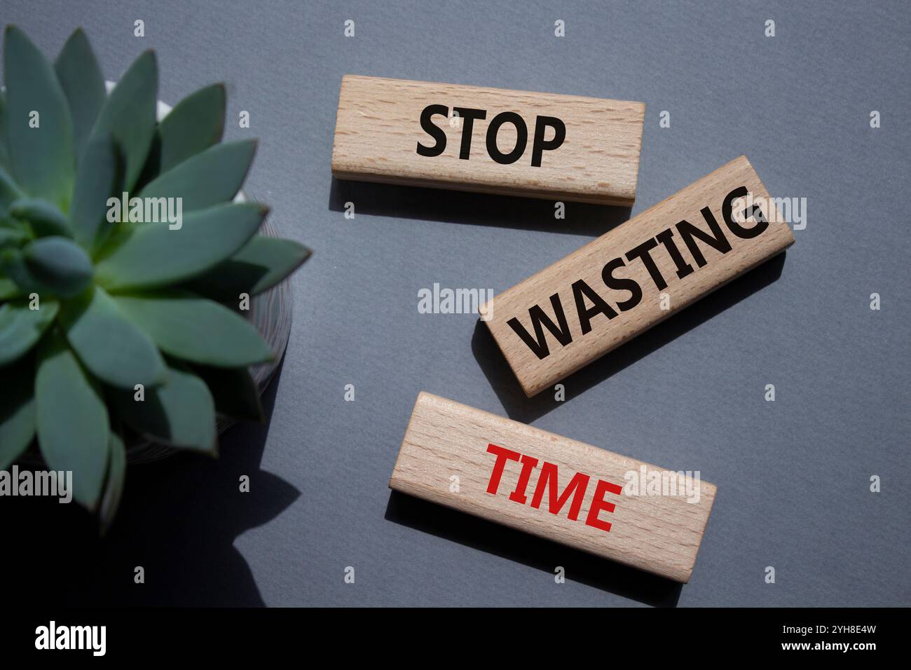Stop Wasting Time symbol. Wooden blocks with words Stop Wasting Time ...