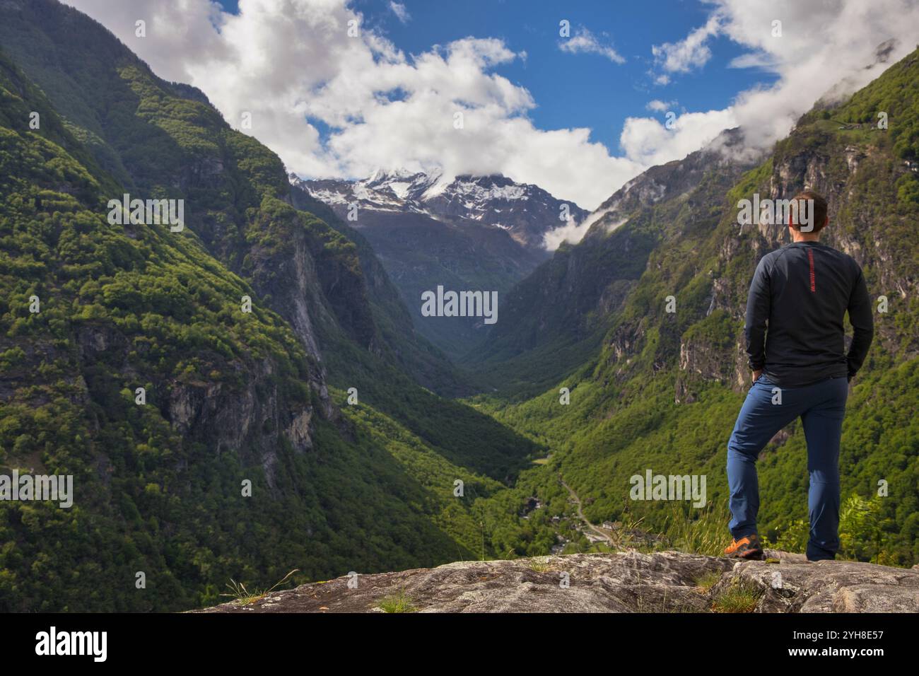 Hiker looking down into Bavona valley Stock Photo - Alamy