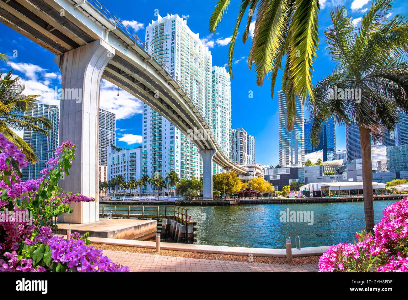 Miami downtown skyline and futuristic mover train above Miami river ...