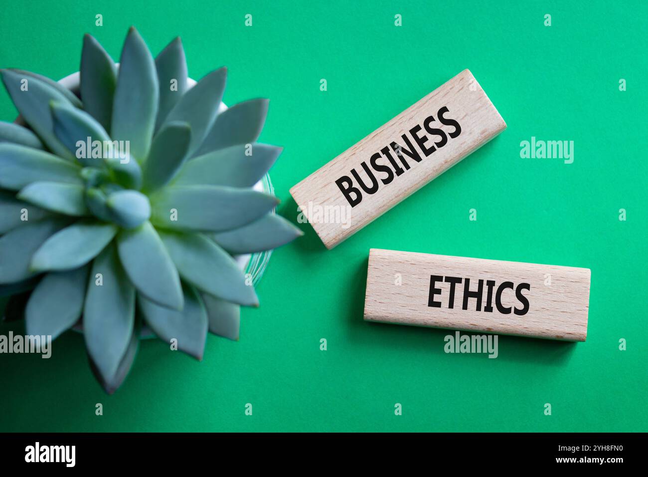 Business ethics symbol. Concept word Business ethics on wooden blocks ...