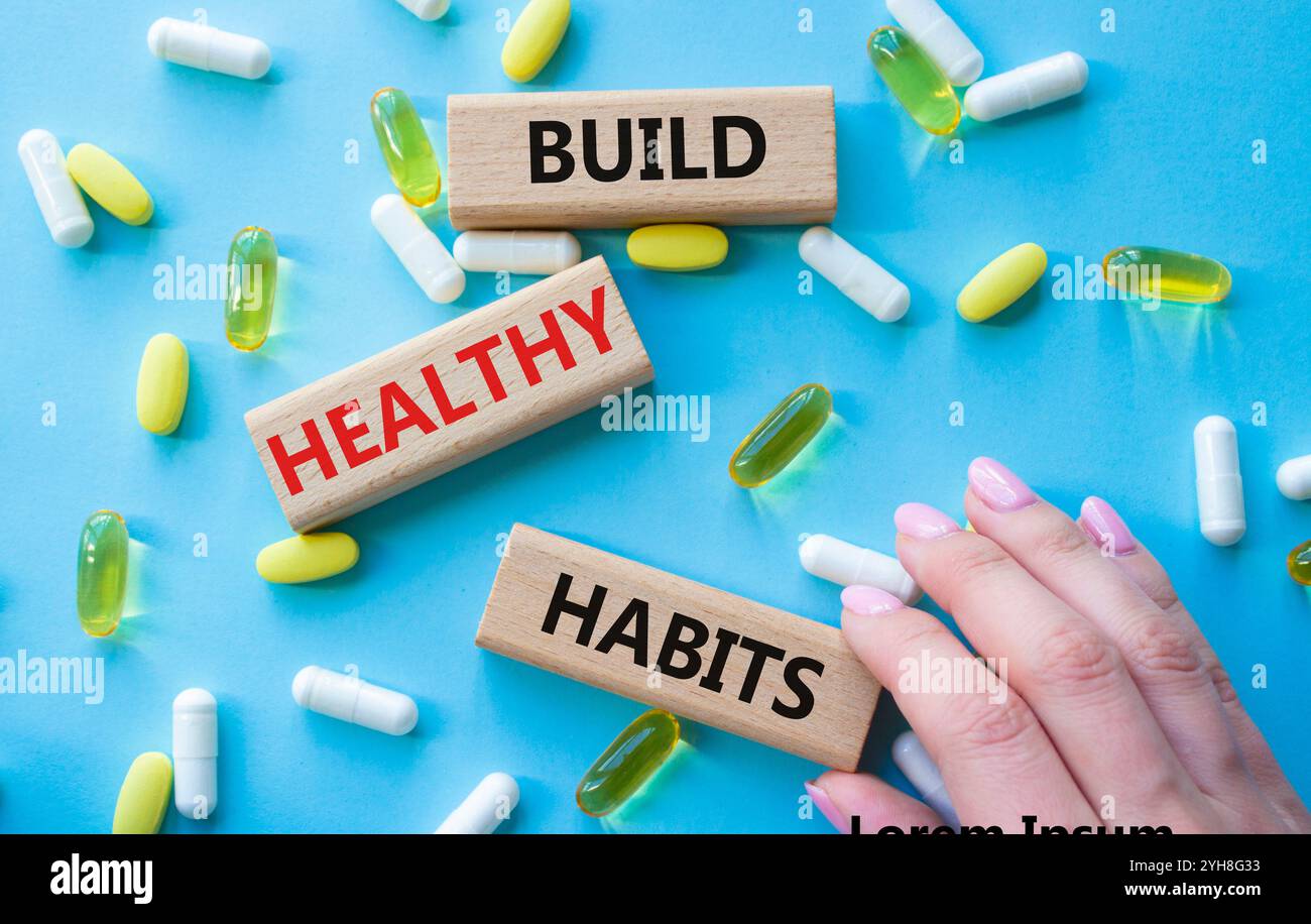 Healthy habits symbol. Concept word Build Healthy habits on wooden ...