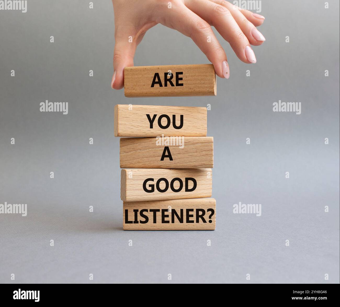 Listening skills symbol. Wooden blocks with words Are you a good ...