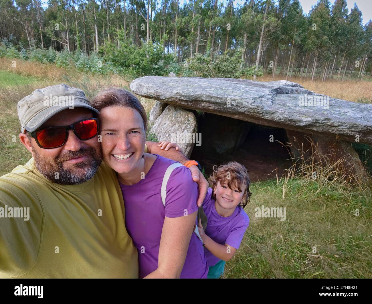 Family taking a selfie in a dolmen in Galicia Stock Photo - Alamy