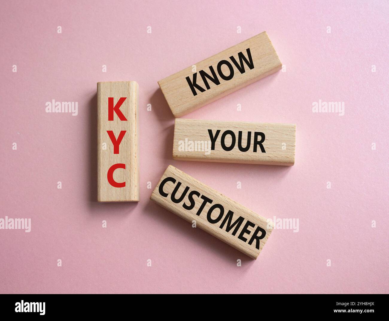 KYC - Know Your Customer. Wooden cubes with word KYC. Beautiful pink ...