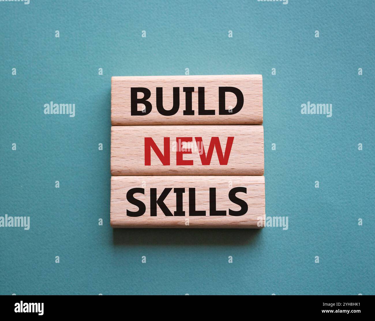 Build New skills symbol. Concept word Build New skills on wooden blocks ...