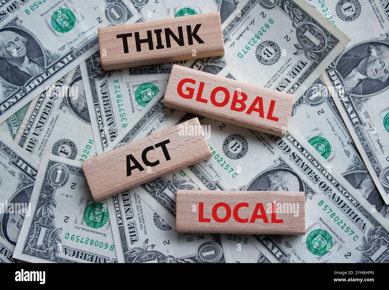 Think global act local symbol. Wooden blocks with words Think global ...