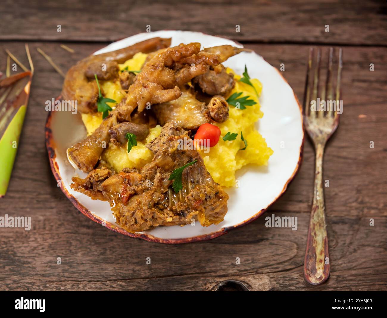 Traditional and rustic Brazilian dish, free-range chicken with polenta ...