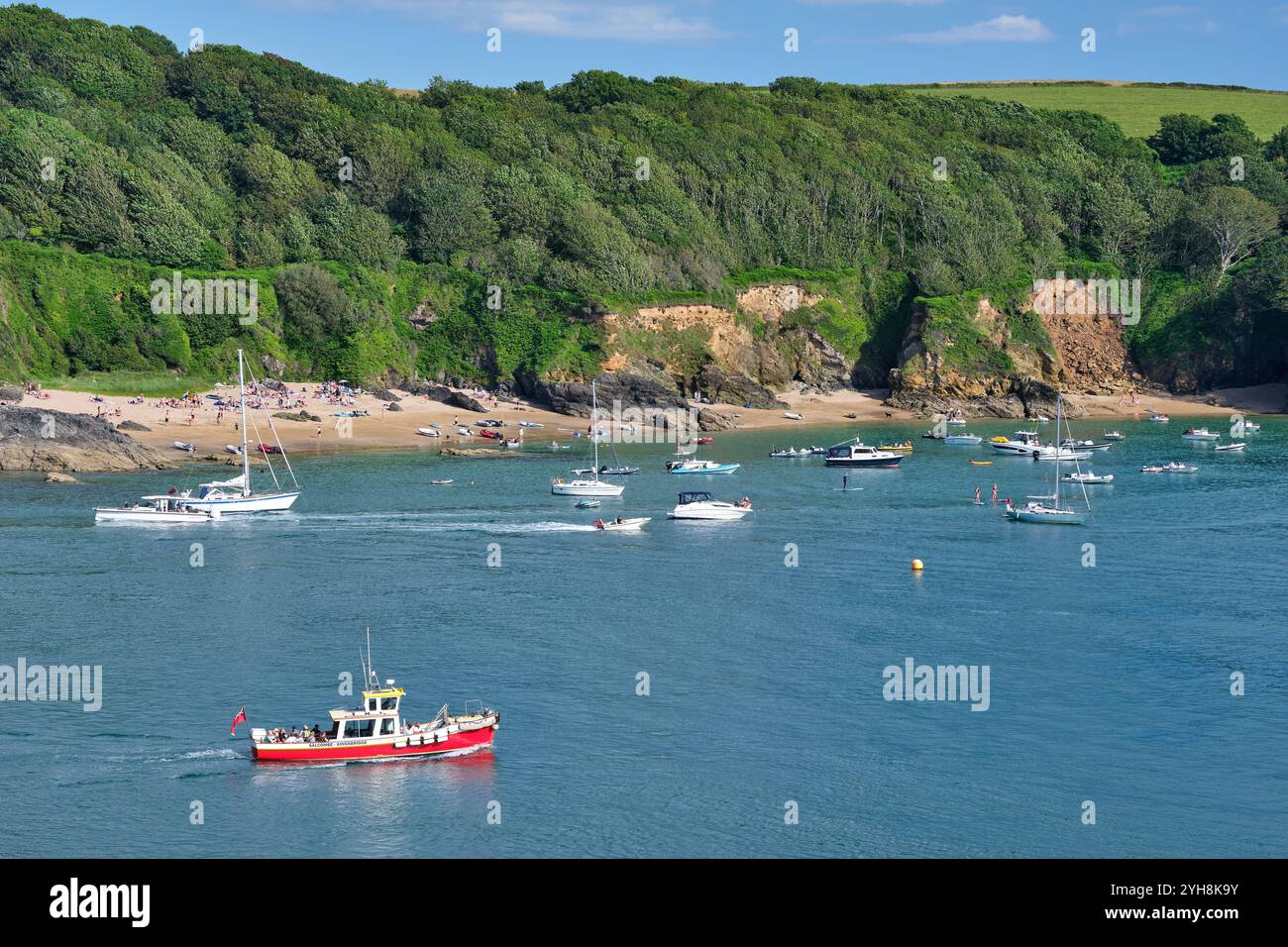View across boats in the Salcombe Estuary to Sunny Cove from the South ...