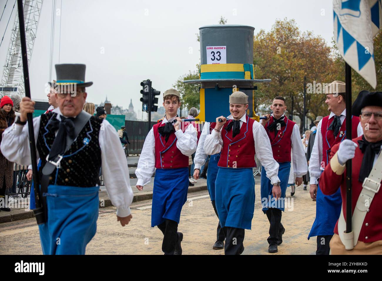 London, UK. 09th Nov, 2024. Felt makers from Switzerland carry a large ...