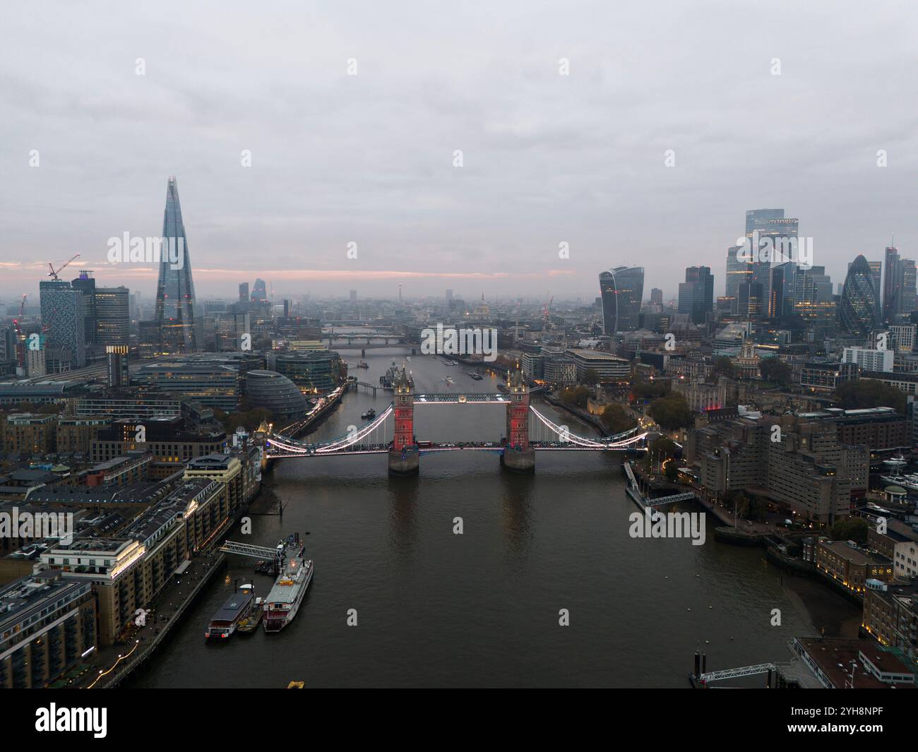 Tower Bridge is lit up red on Remembrance Sunday in London. Picture ...