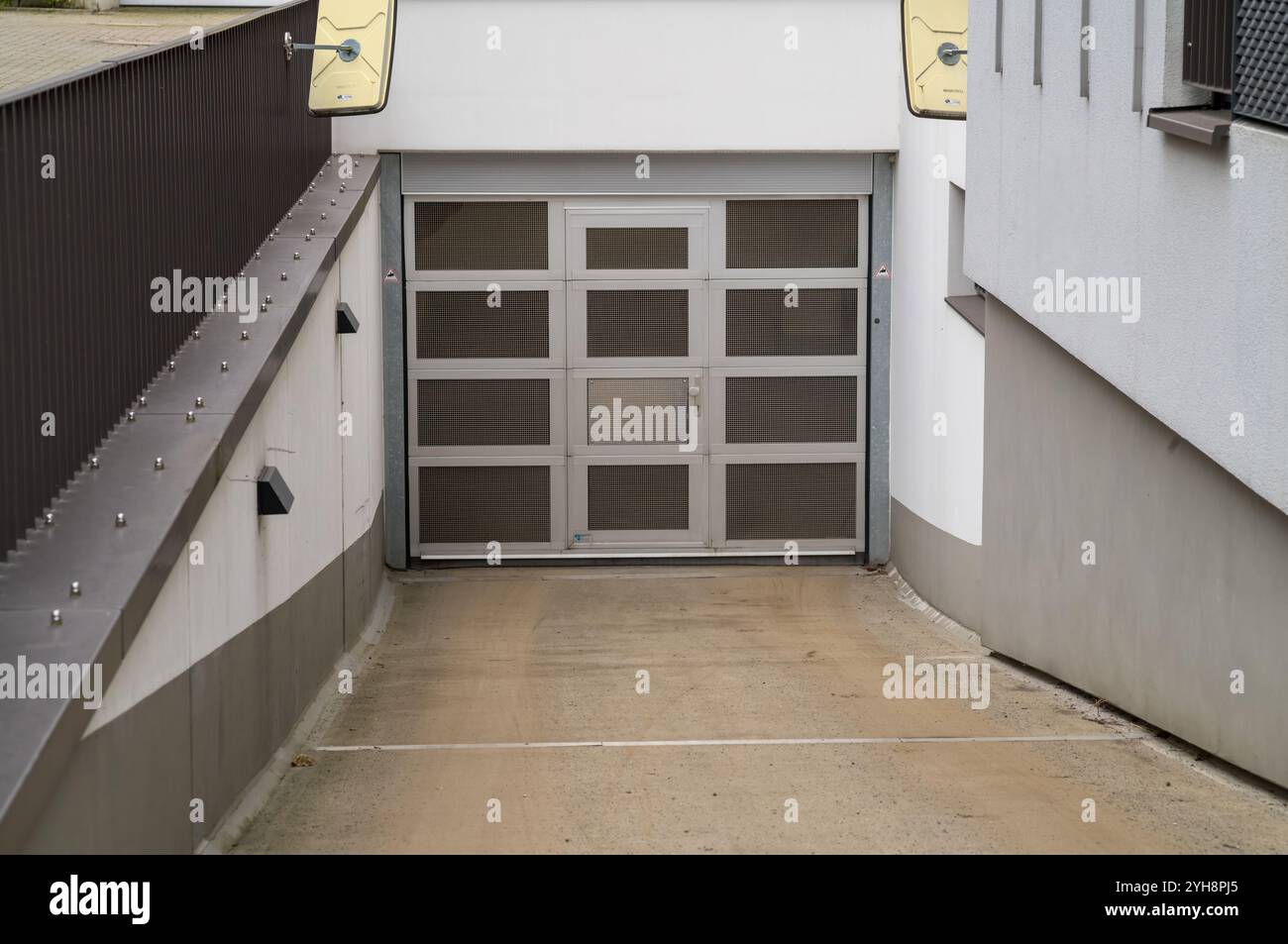 Sectional garage door closing in an underground garage of a modern ...