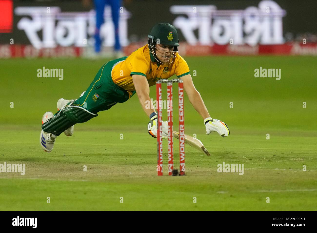 South Africa's Gerald Coetzee dives to make it successfully into the ...