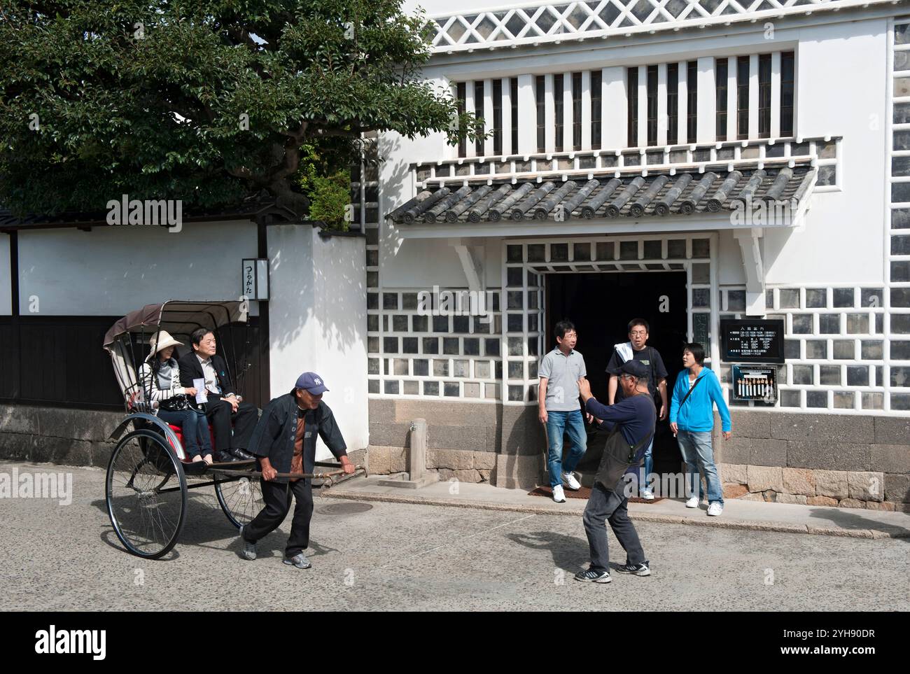 Tourists enjoying sights on a sunny day out in the traditional ...