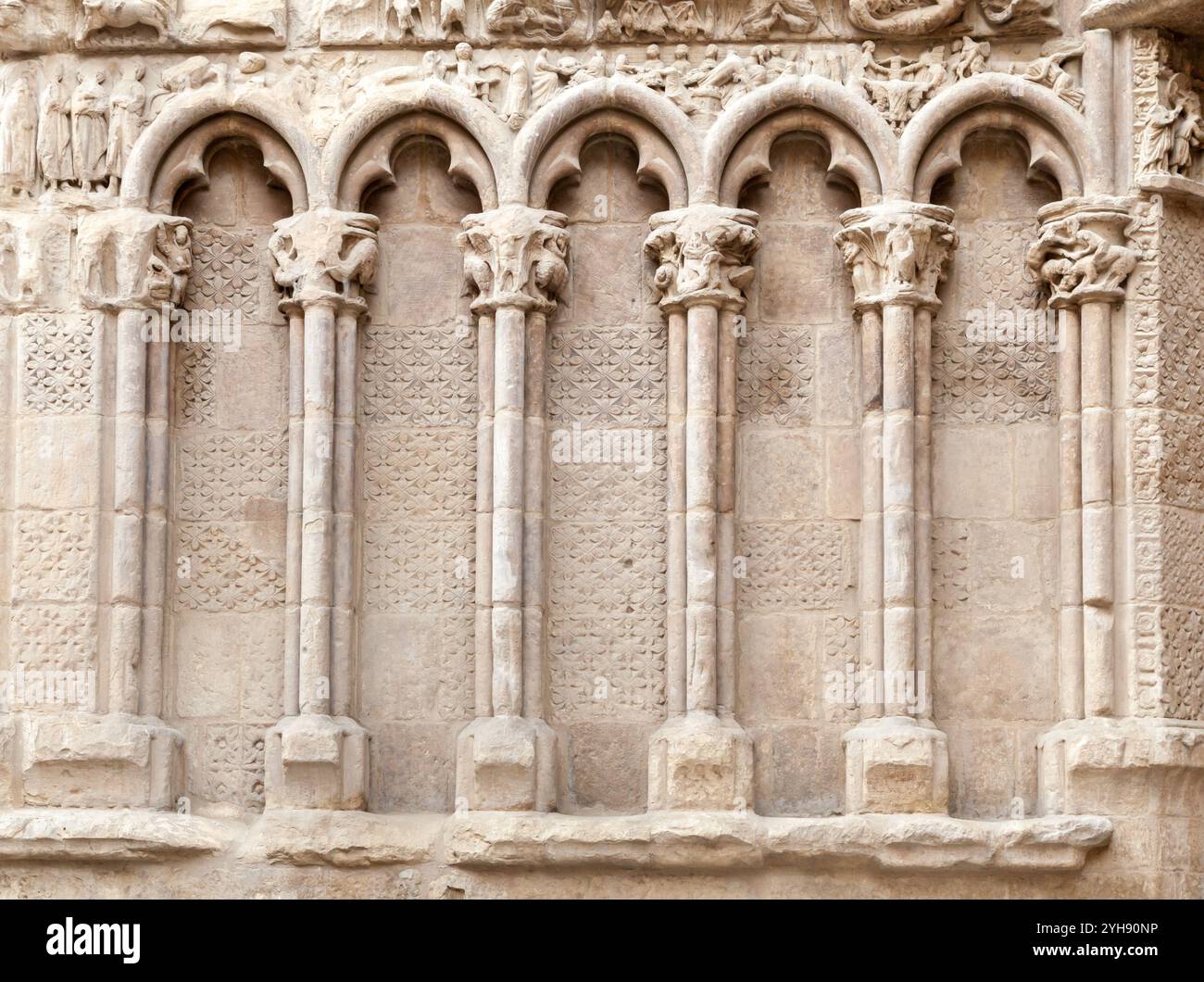 Intricate carvings adorn the columns and arches of an ancient church's ...