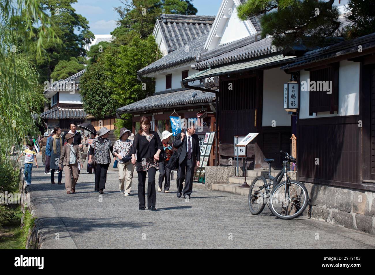 Tourists enjoying sights on a sunny day out in the traditional ...