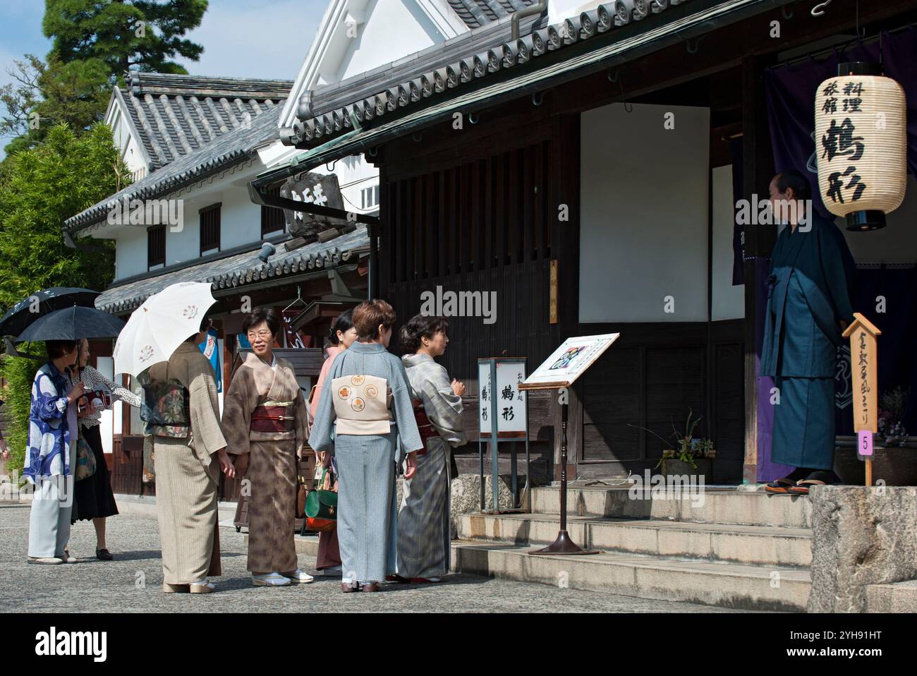 Tourists enjoying sights on a sunny day out in the traditional ...