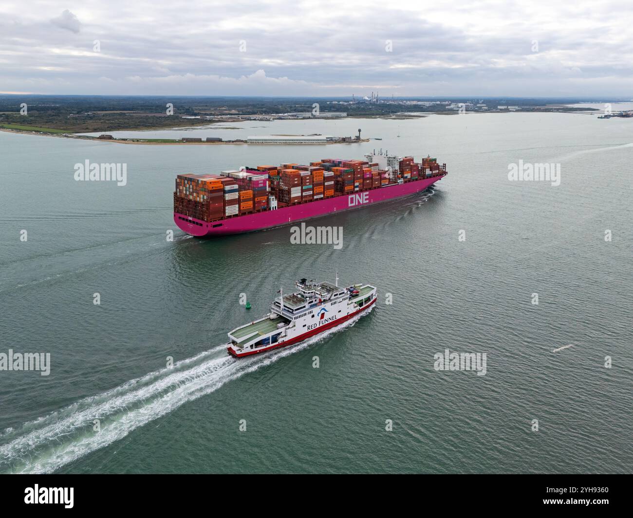 A busy shipping scene on Southampton Water with a container ship and ...