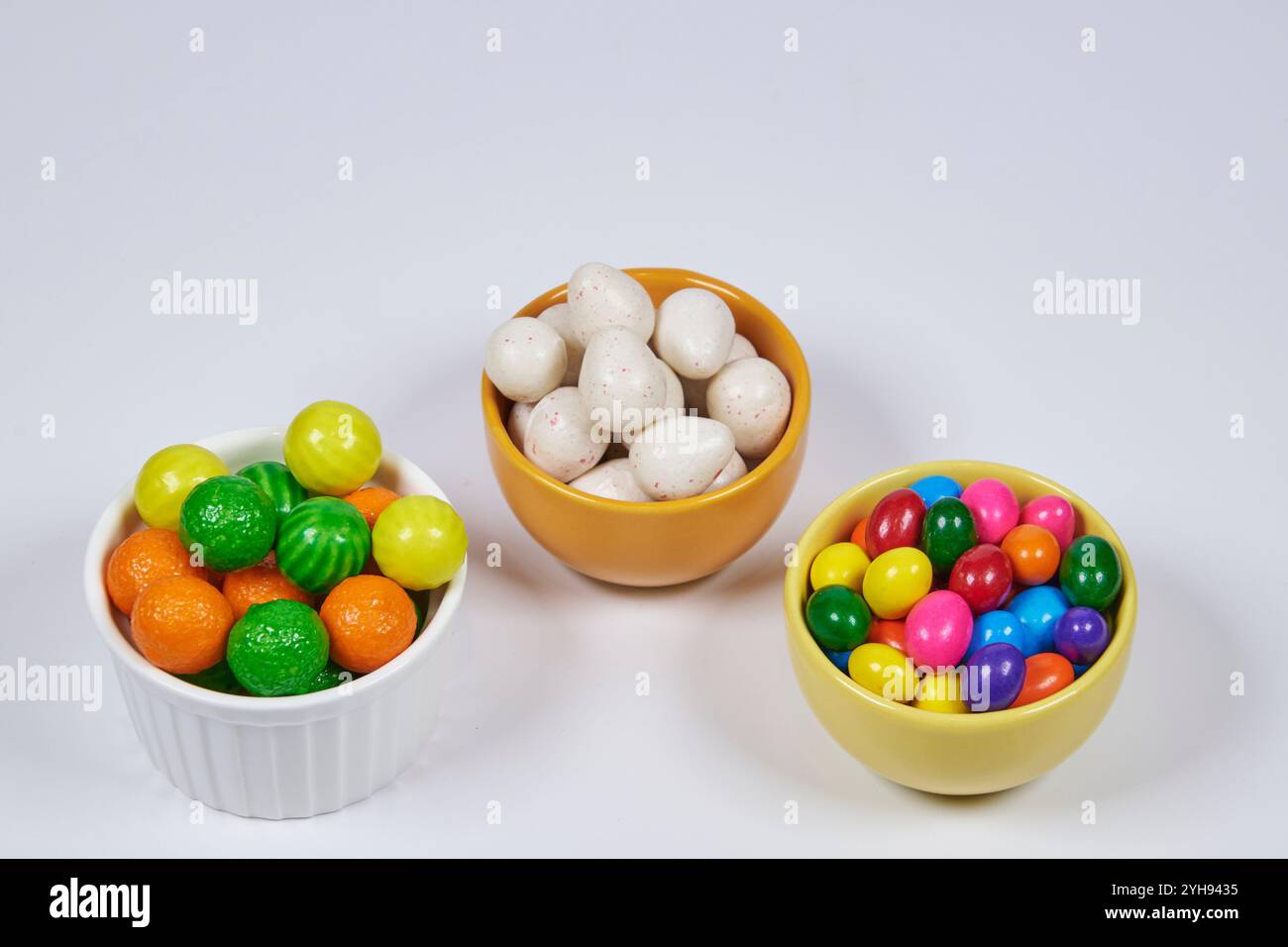 Gumballs of different colors and flavors representing fruits such as ...