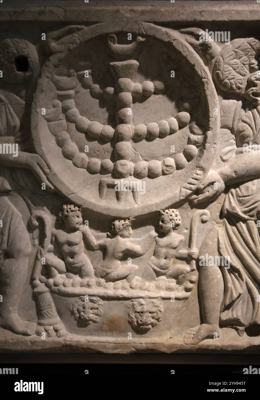Jewish Seasons sarcophagus. Two standing Victories, flanked by a figure ...