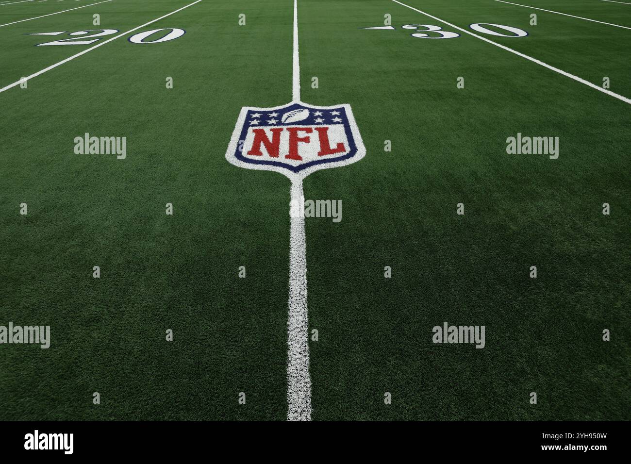 NFL shield logo on the field before an NFL football game between the ...