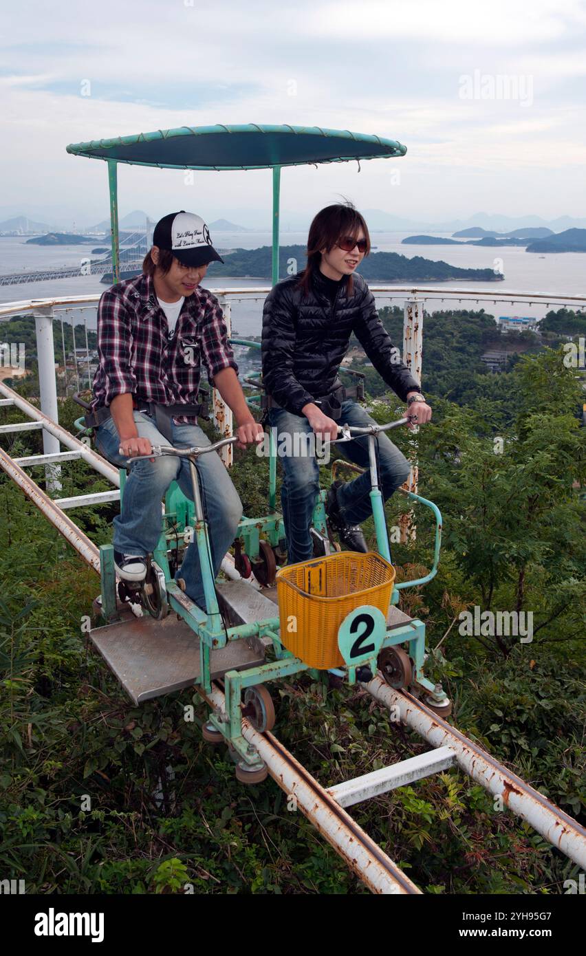 Visitors to Washuzan Highland amusement park enjoying exercise on the ...