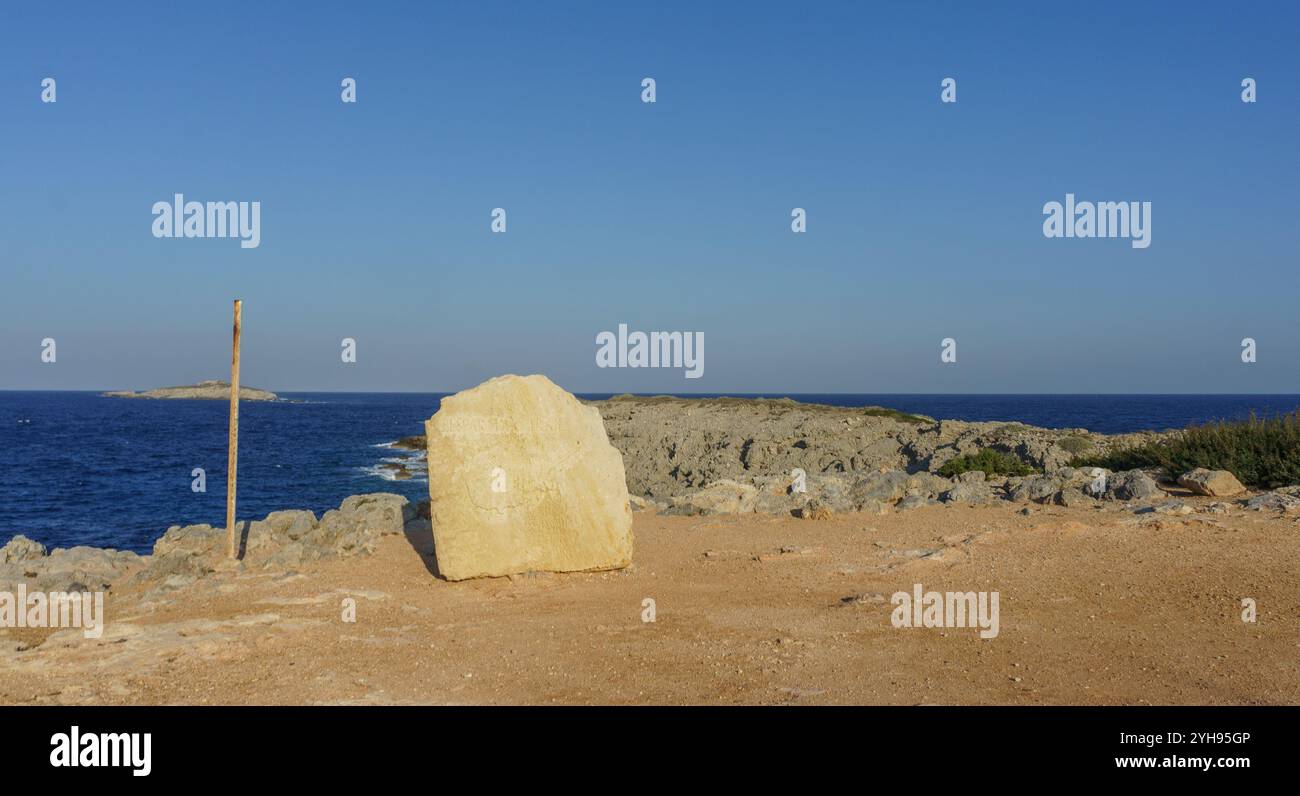 The tranquil vista features a prominent limestone rock set against the ...